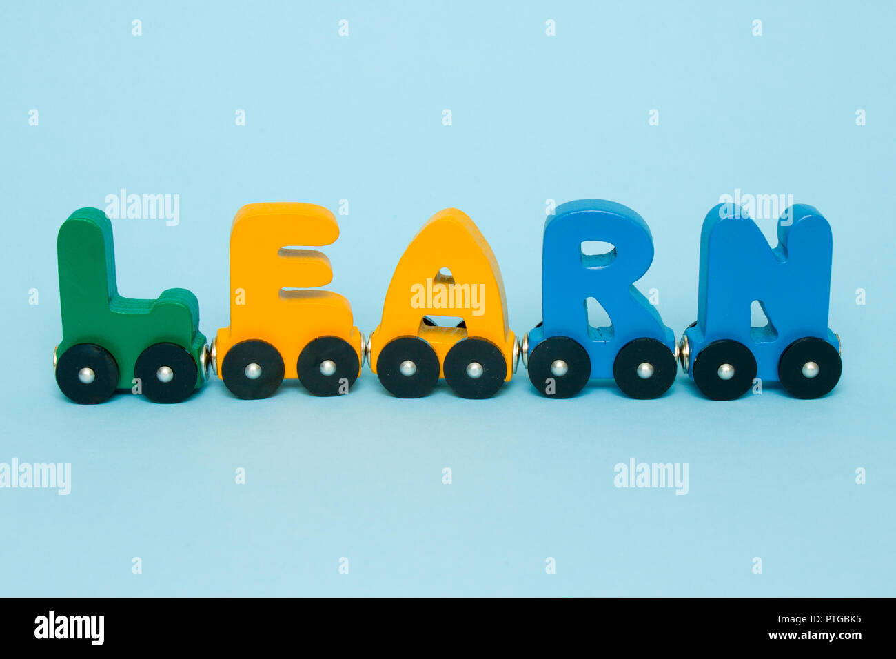 Word Learn made of letters train alphabet. Bright colors of red yellow ...