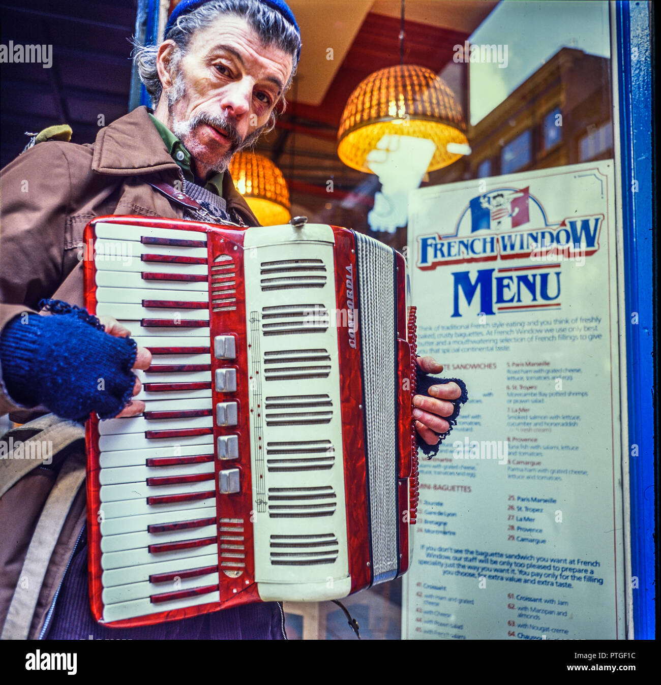 Manchester, England, Uk January 1989: An old homeless street musician ...