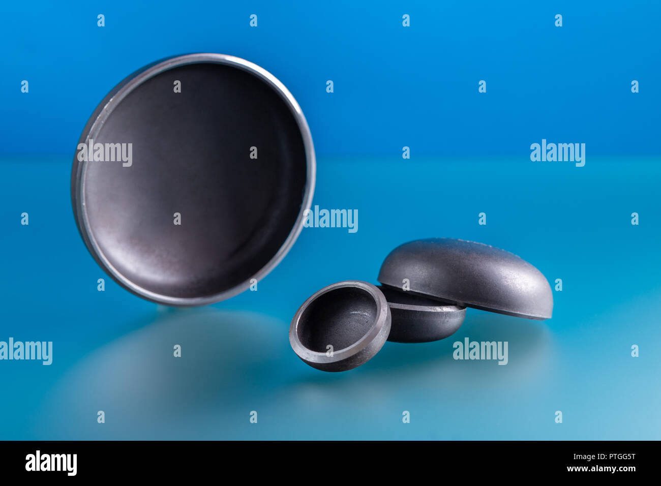 Steel cups, set of steel welding fittings Stock Photo - Alamy