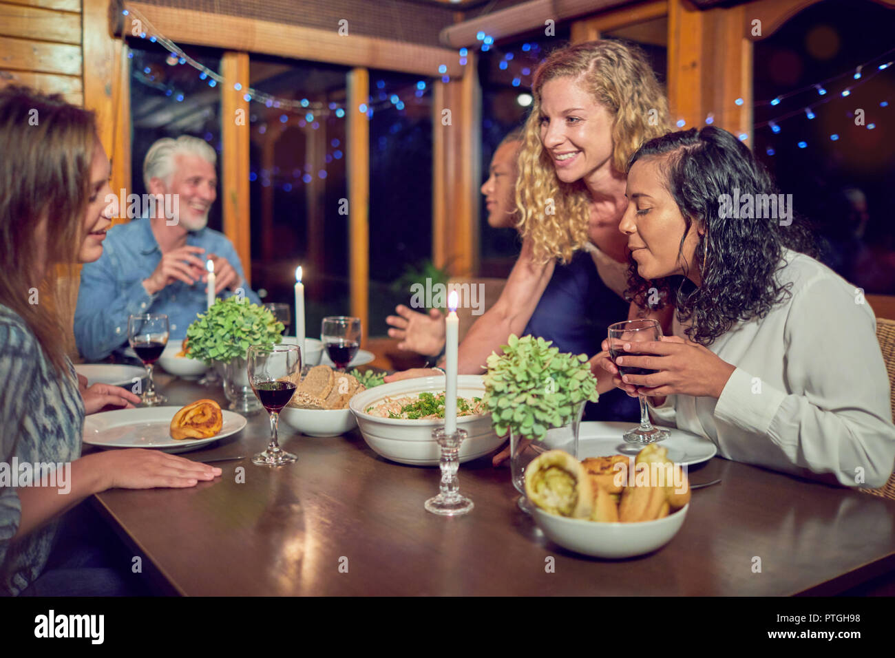 Friends family together dinner in hi-res stock photography and images ...