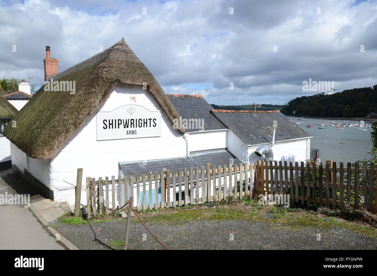 The thatched and whitewashed village pub, the Shipwrights Arms on the ...