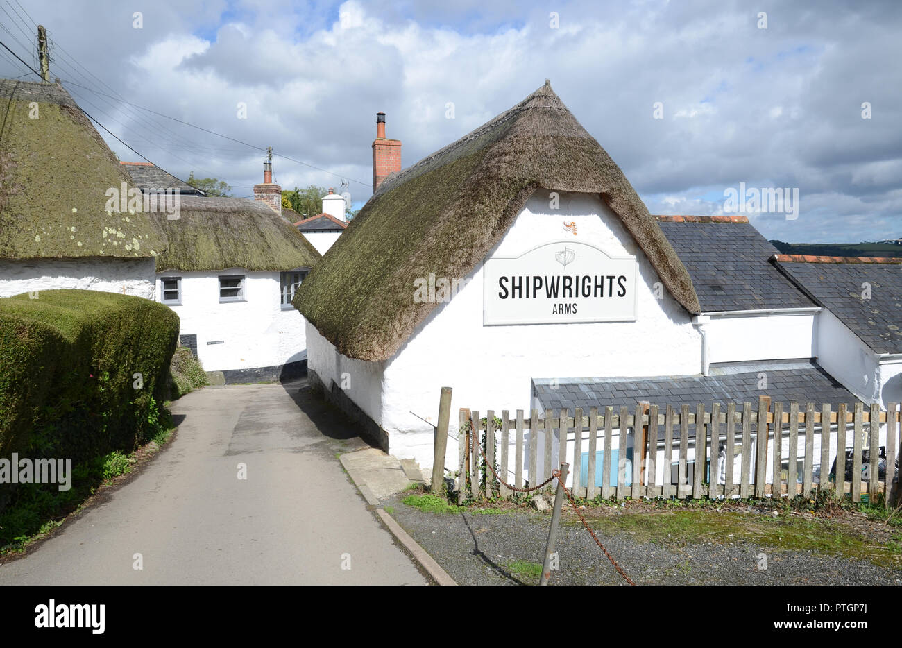 The thatched and whitewashed village pub, the Shipwrights Arms on the ...