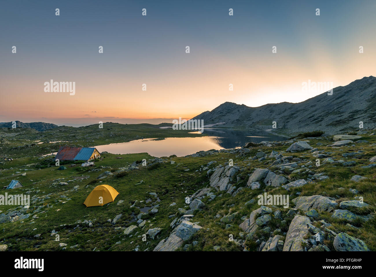 Sunset landscape with Kamenitsa peak and Tevno lake, Pirin Mountain ...