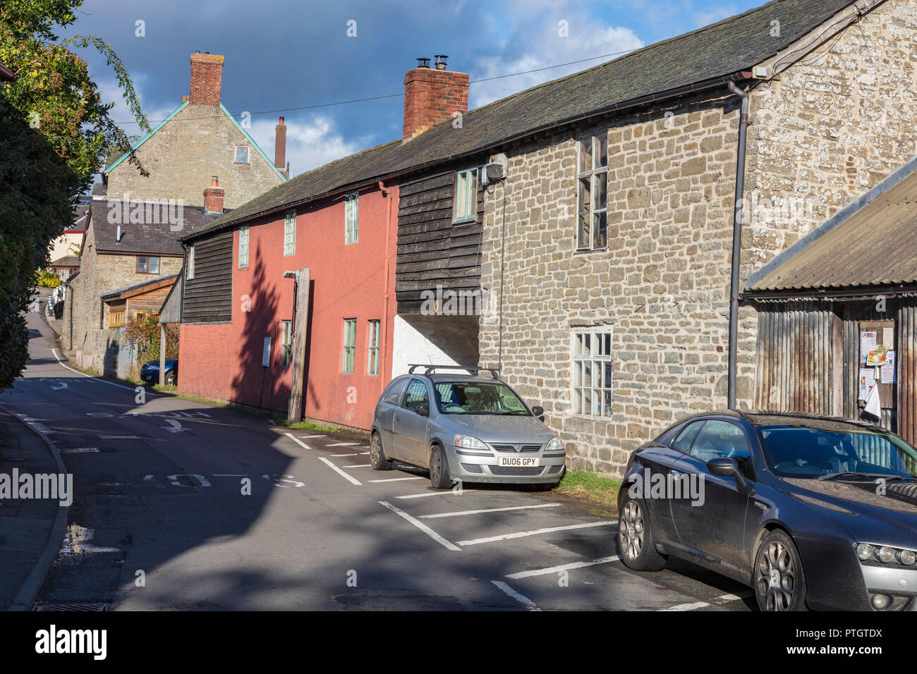 Narrow street with cottages and converted barn in the pretty village of ...