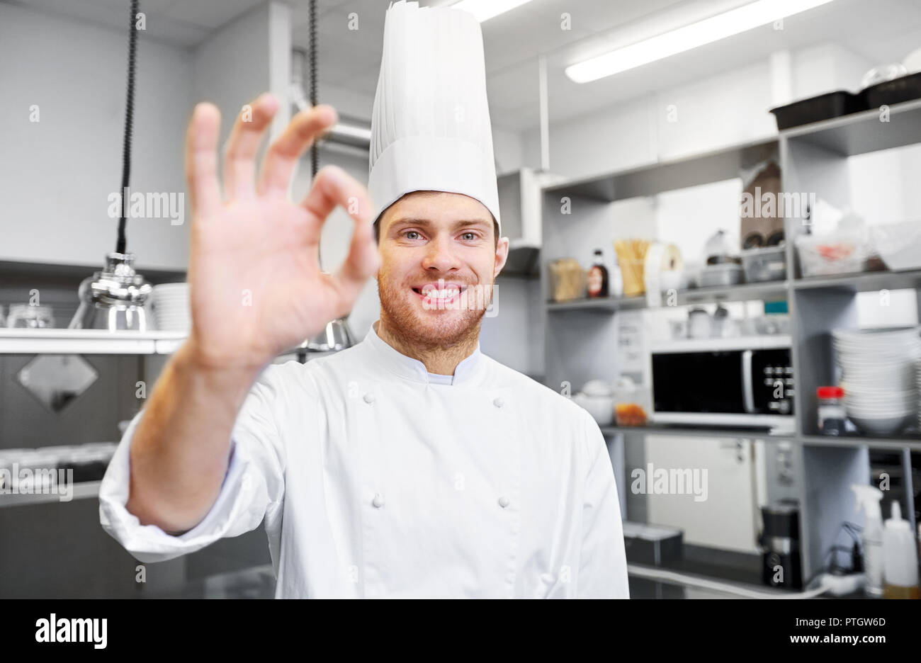 Handsome cooking chef showing hi-res stock photography and images - Alamy