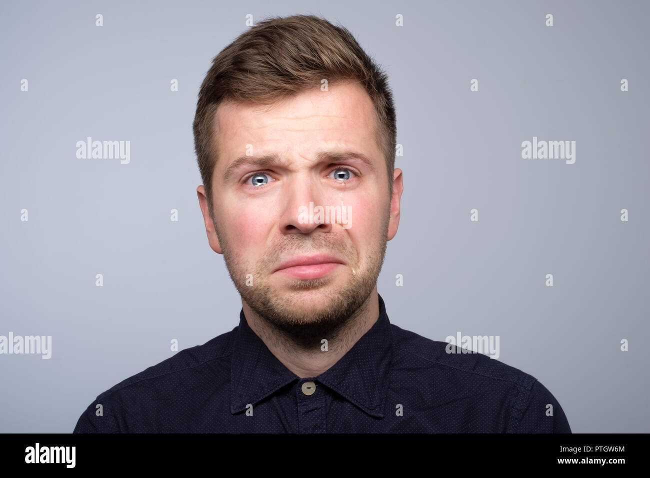 Tears in eyes of crying adult european man. He has lost his girlfriend ...