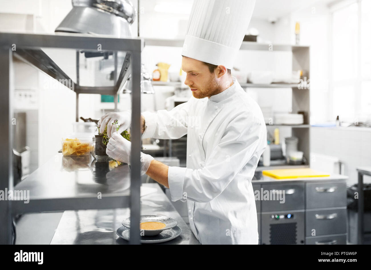 Handsome chef cooking hi-res stock photography and images - Alamy