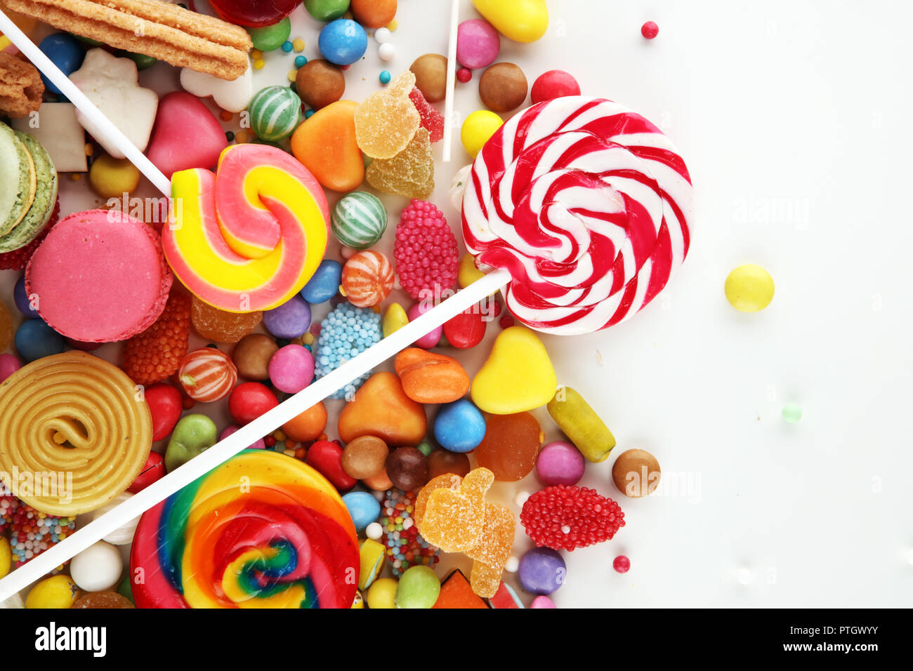 candies with jelly and sugar. colorful array of different childs sweets ...