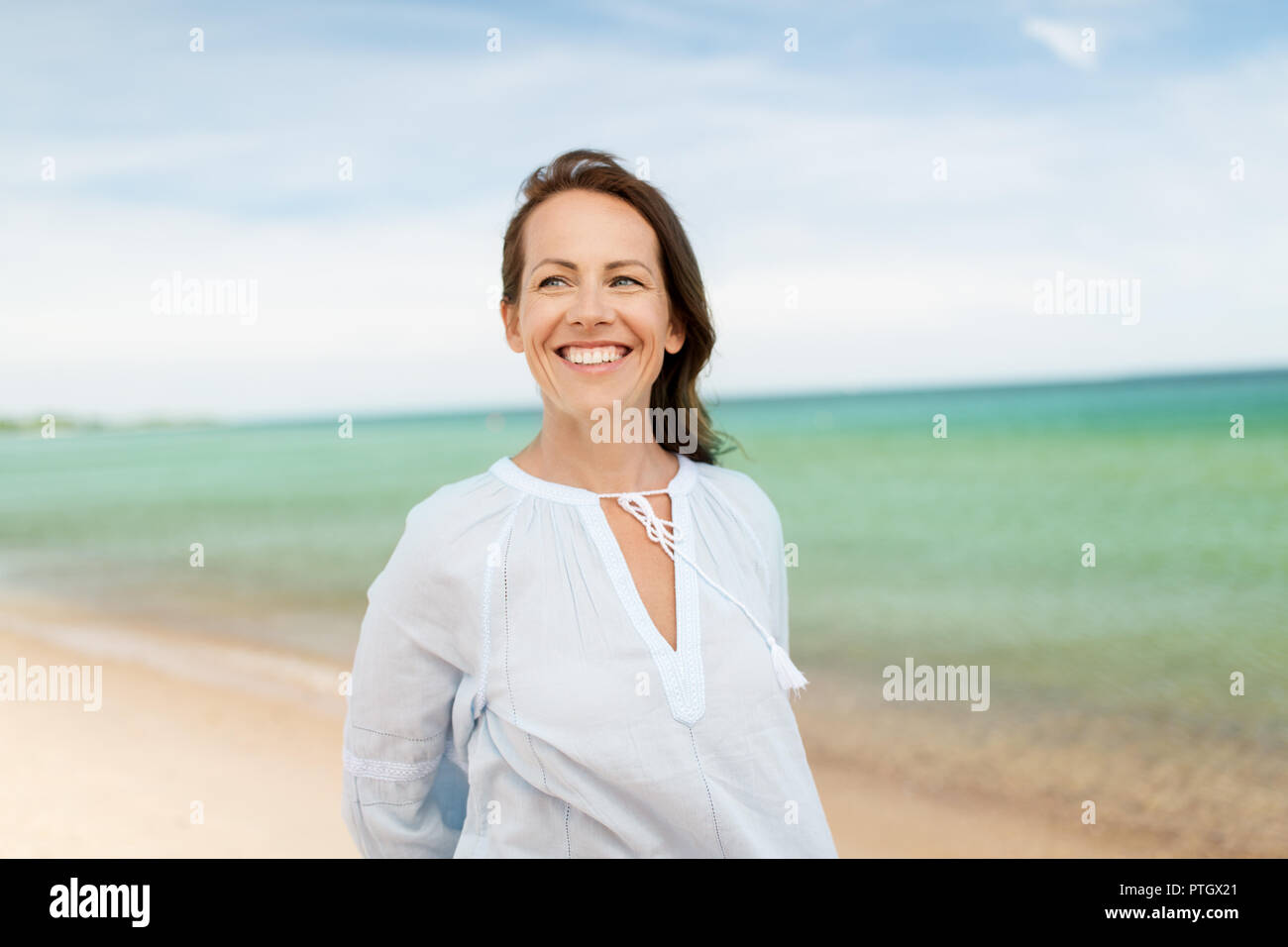 happy smiling woman on summer beach Stock Photo - Alamy