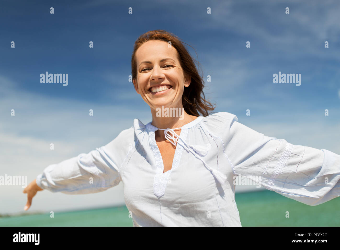 happy smiling woman on summer beach Stock Photo - Alamy