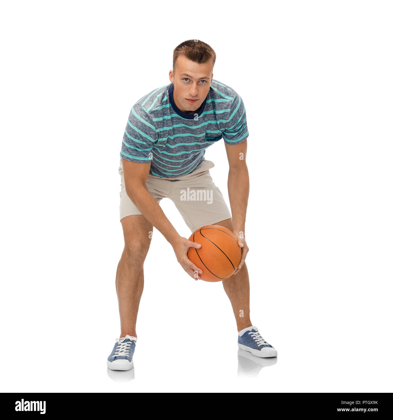 Happy young guy playing basketball hi-res stock photography and images ...