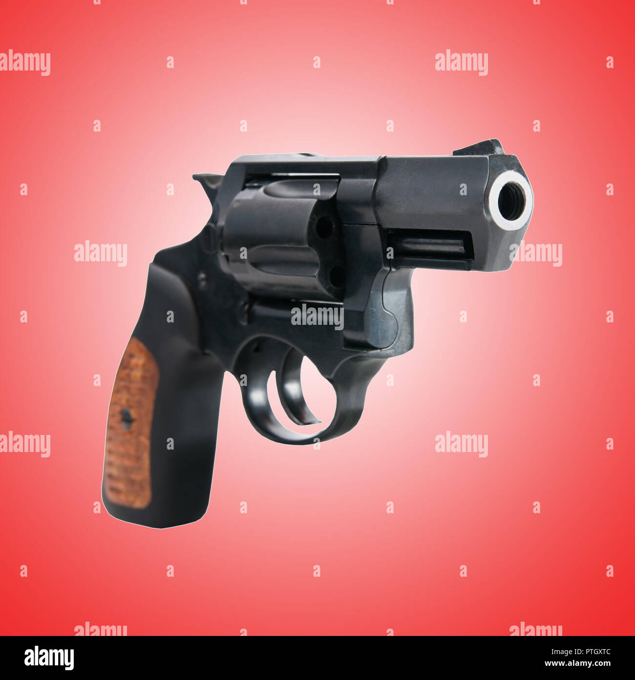 gun on a red background Stock Photo - Alamy