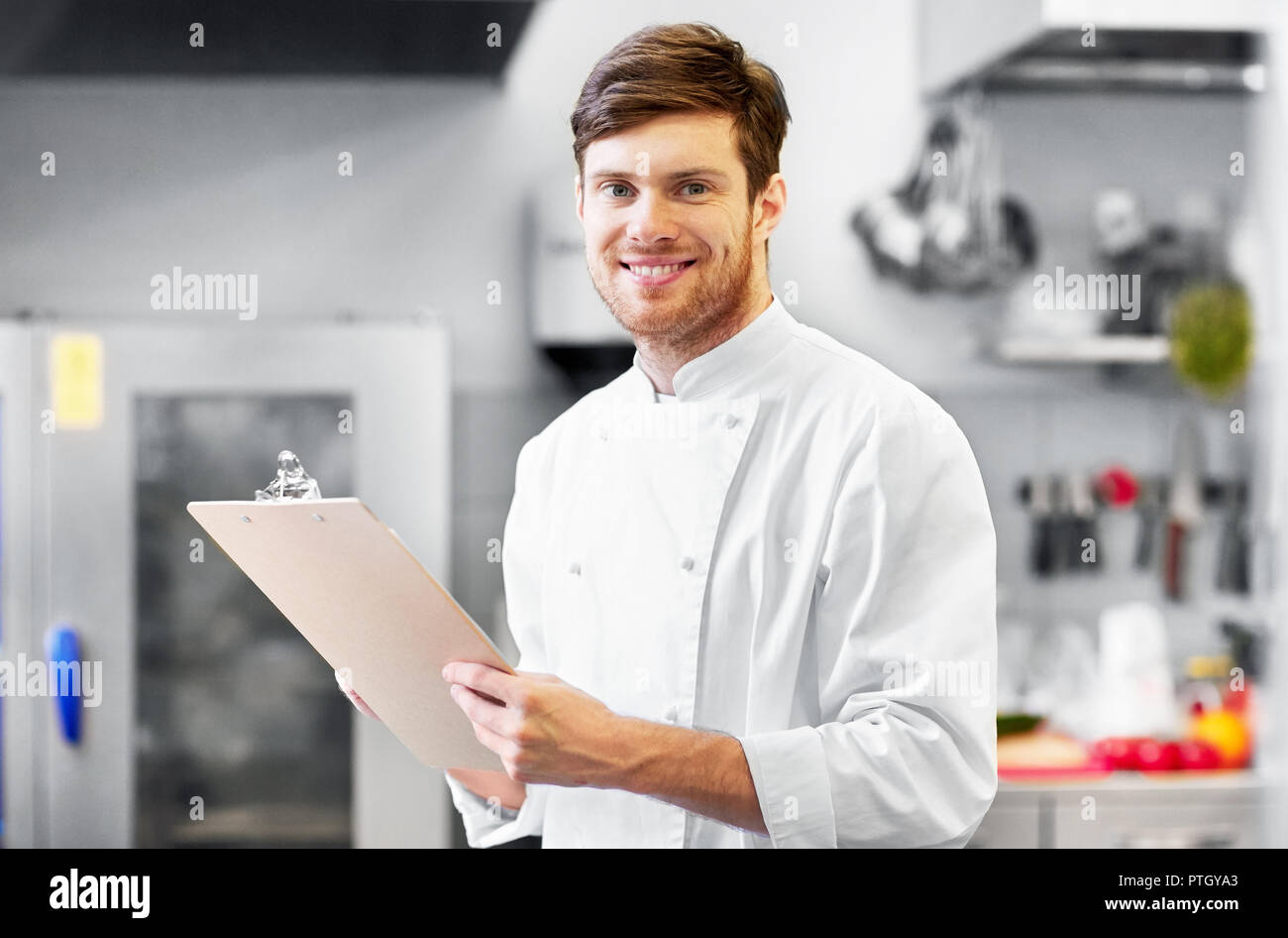 chef with clipboard doing inventory at restaurant Stock Photo - Alamy