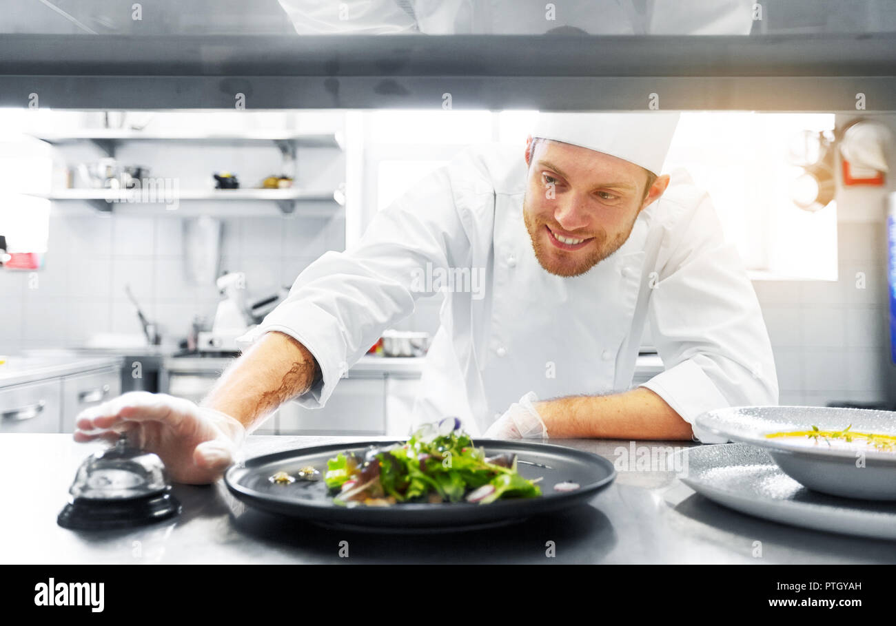 happy male chef cooking food at restaurant kitchen Stock Photo - Alamy