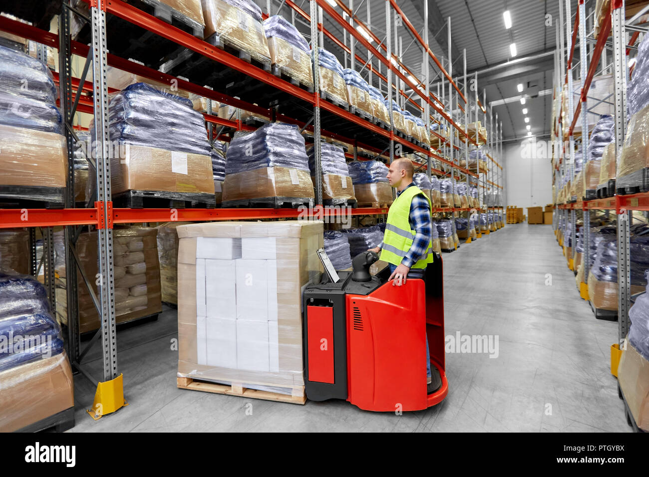 loader operating forklift at warehouse Stock Photo - Alamy