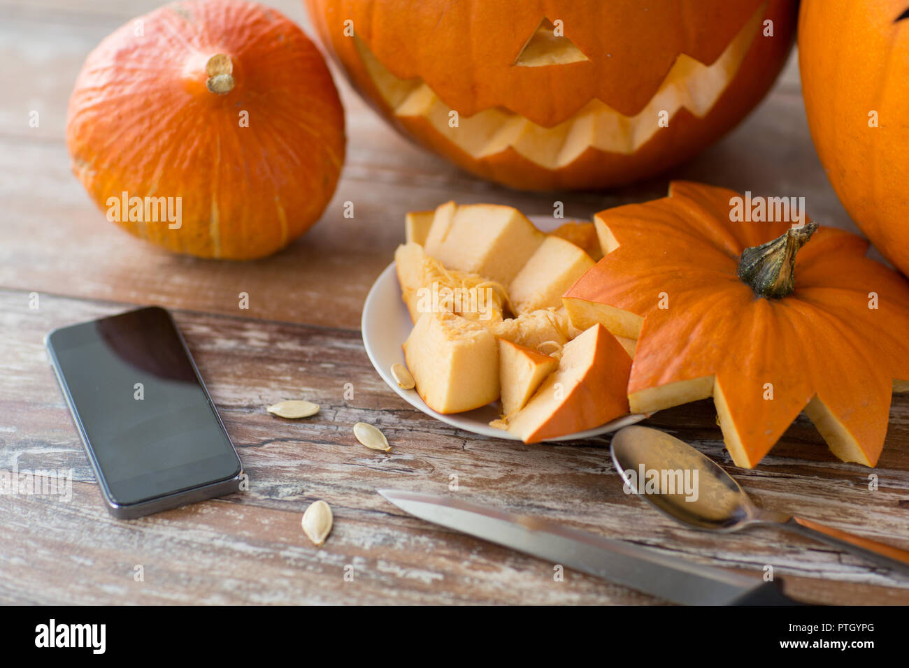 halloween jack-o-lantern, pumpkins and smartphone Stock Photo - Alamy