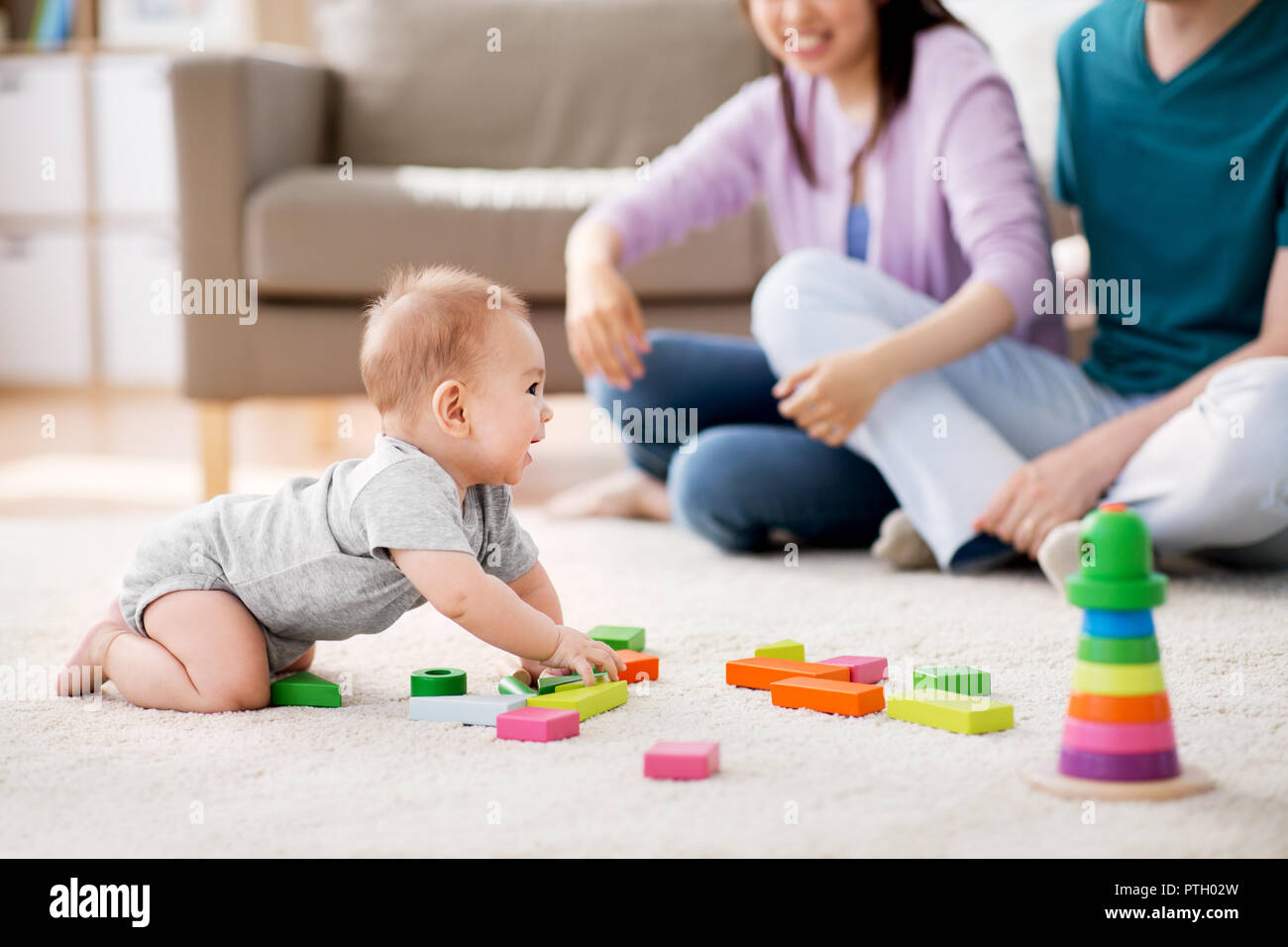 happy family with baby boy playing at home Stock Photo - Alamy