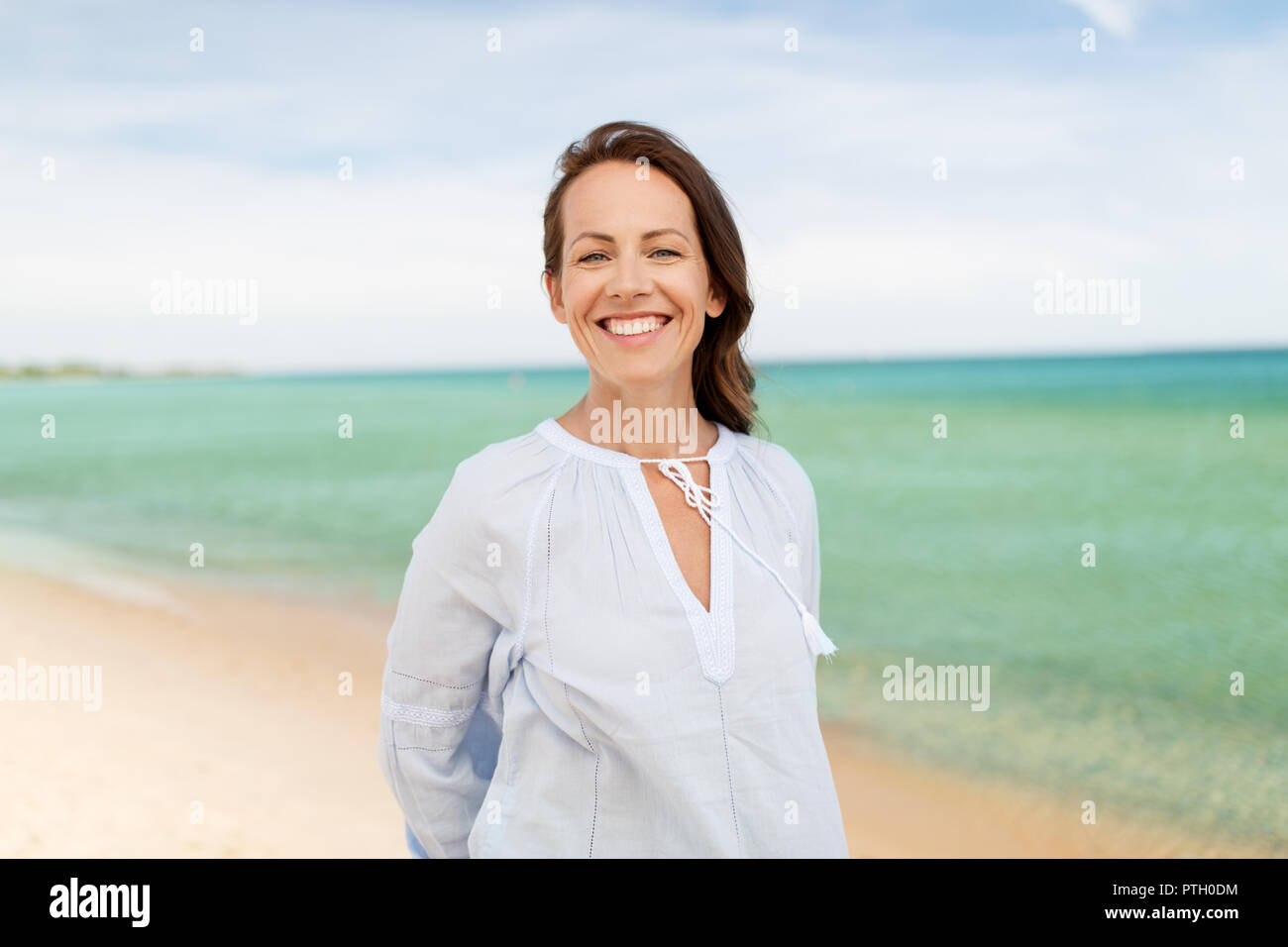 happy smiling woman on summer beach Stock Photo - Alamy