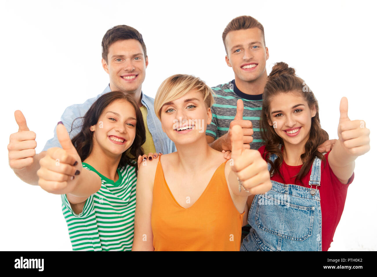 happy friends showing thumbs up Stock Photo - Alamy