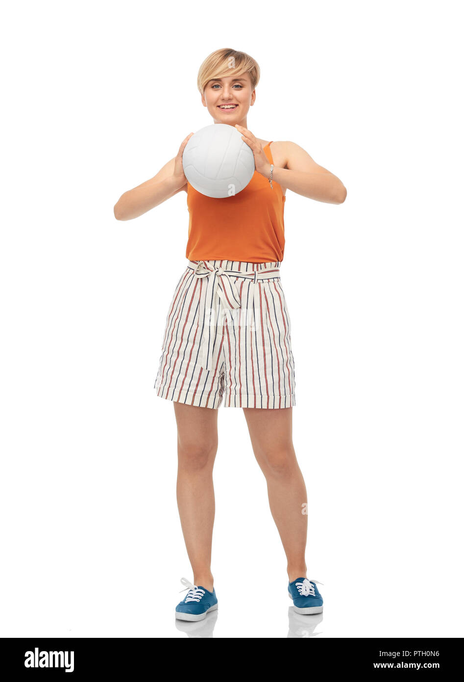 smiling teenage girl playing volleyball Stock Photo - Alamy
