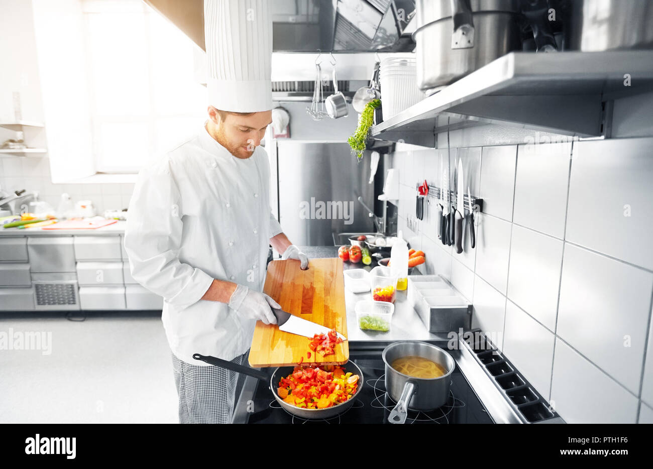 male chef cooking food at restaurant kitchen Stock Photo - Alamy