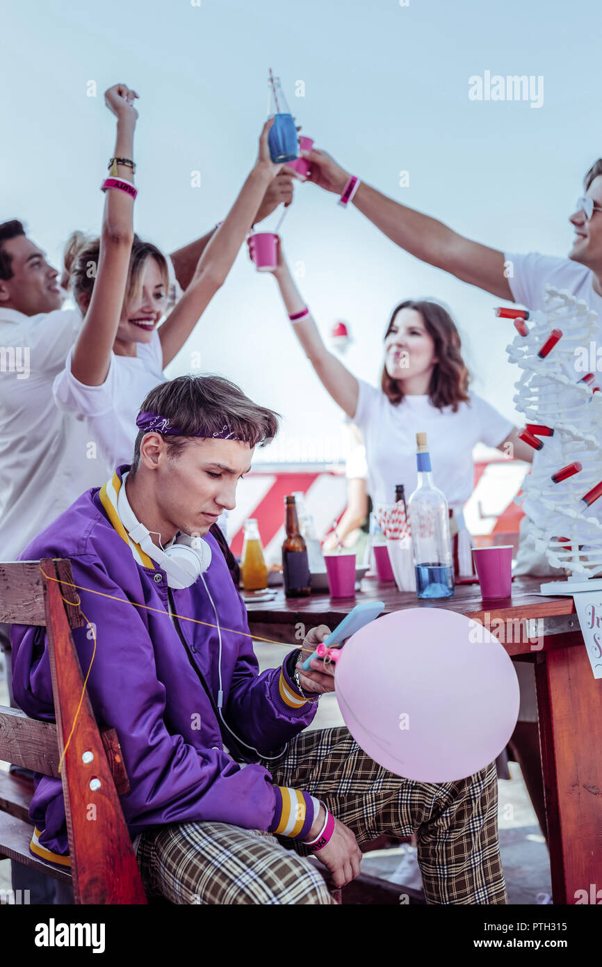 Happy students having open-air party on rooftop Stock Photo - Alamy