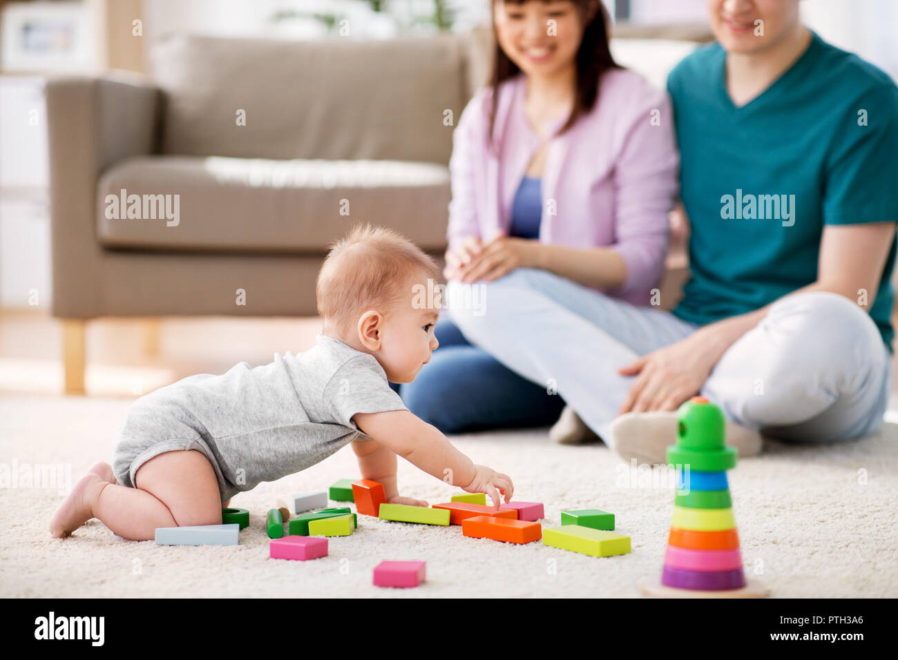 happy family with baby boy playing at home Stock Photo - Alamy
