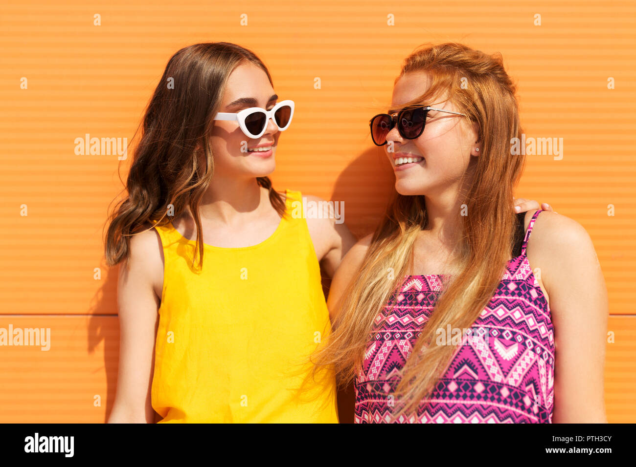 teenage girls in summer clothes hugging outdoors Stock Photo - Alamy