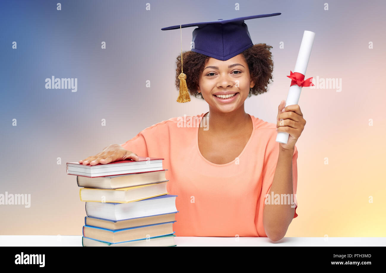 african graduate student with books and diploma Stock Photo - Alamy