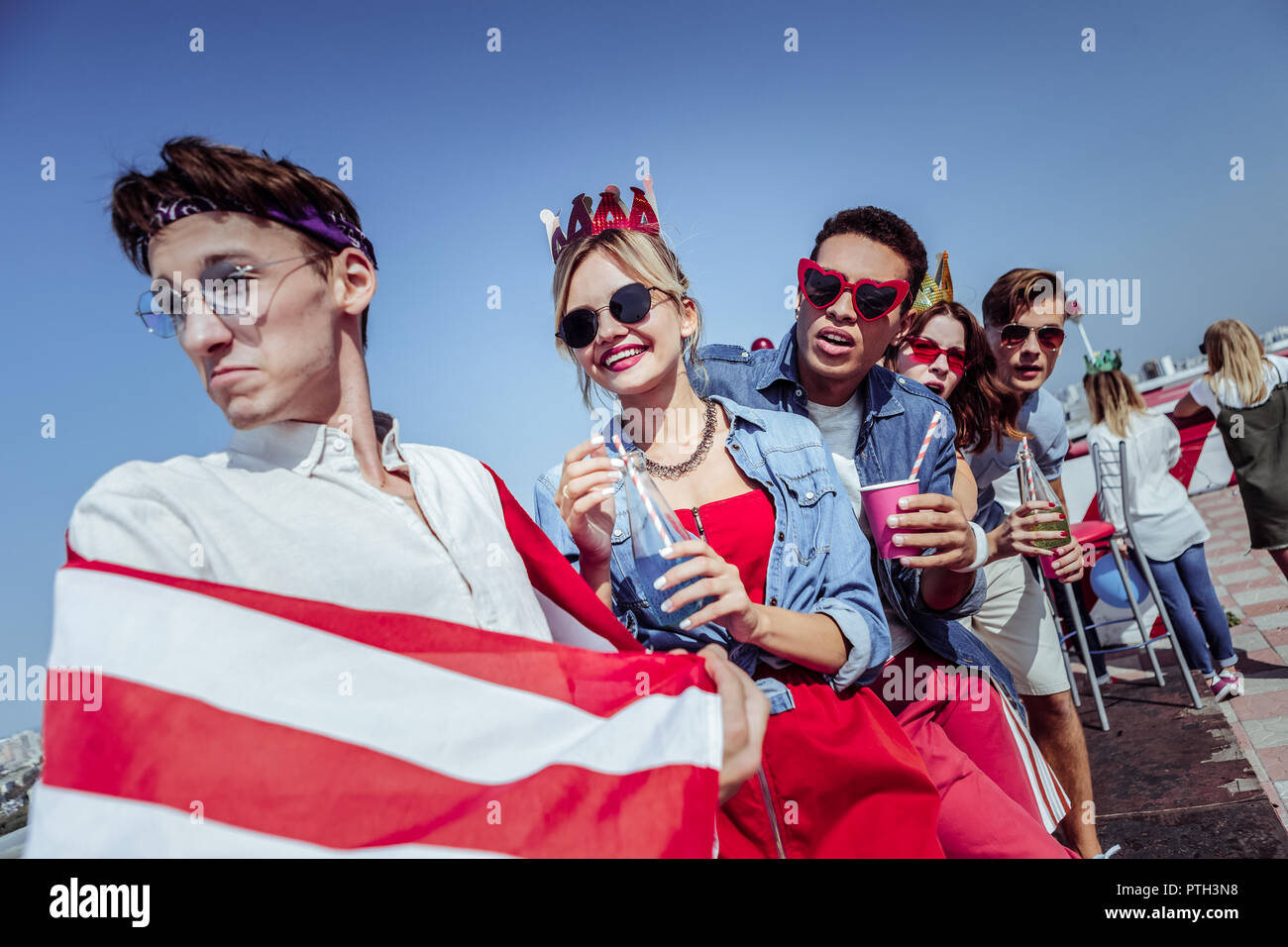 Positive delighted people standing together in line Stock Photo - Alamy