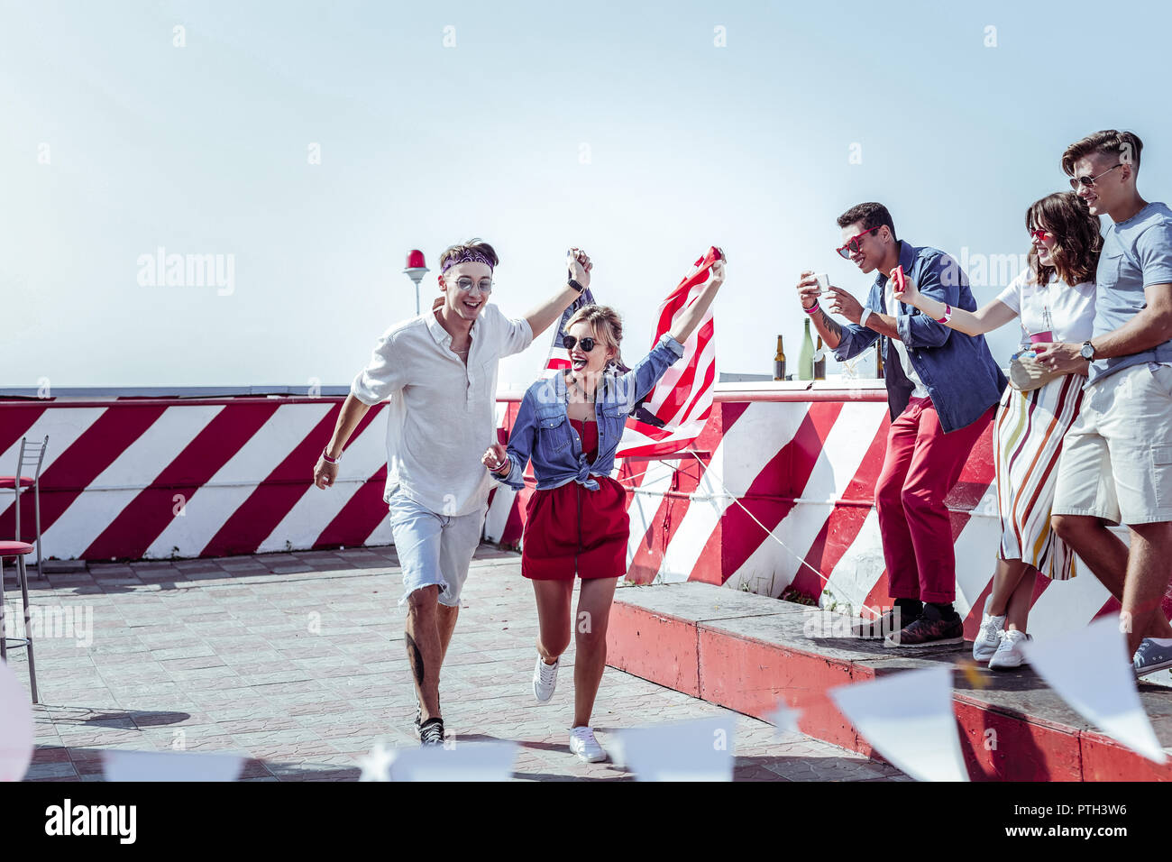 Cheerful students looking forward at modern performance Stock Photo - Alamy