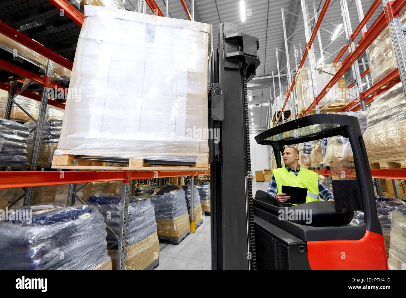 loader operating forklift at warehouse Stock Photo - Alamy