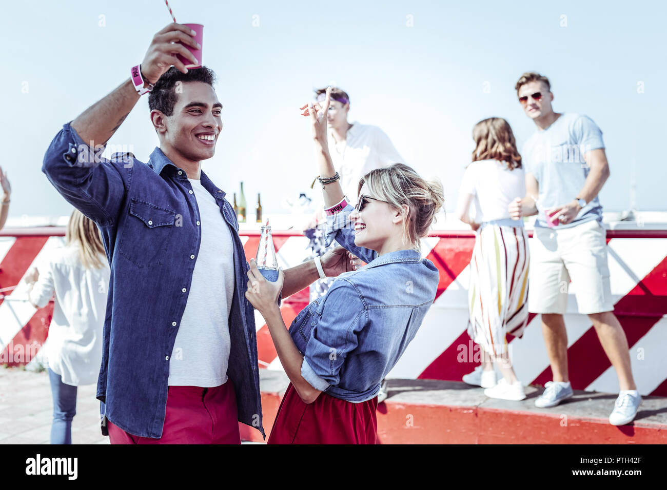 Positive delighted people that dancing on rooftop Stock Photo - Alamy