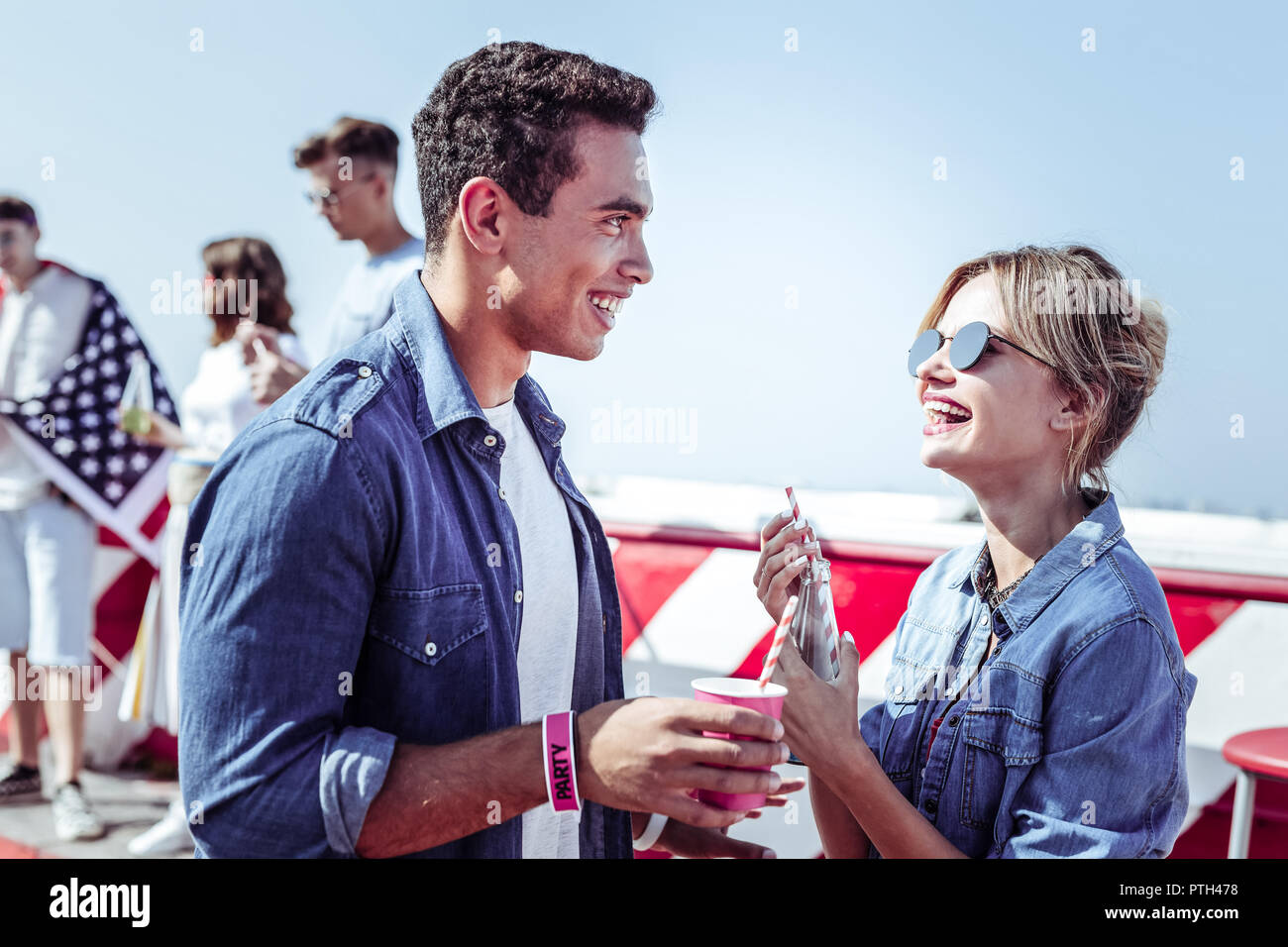 Cheerful male person standing in front of his friend Stock Photo - Alamy