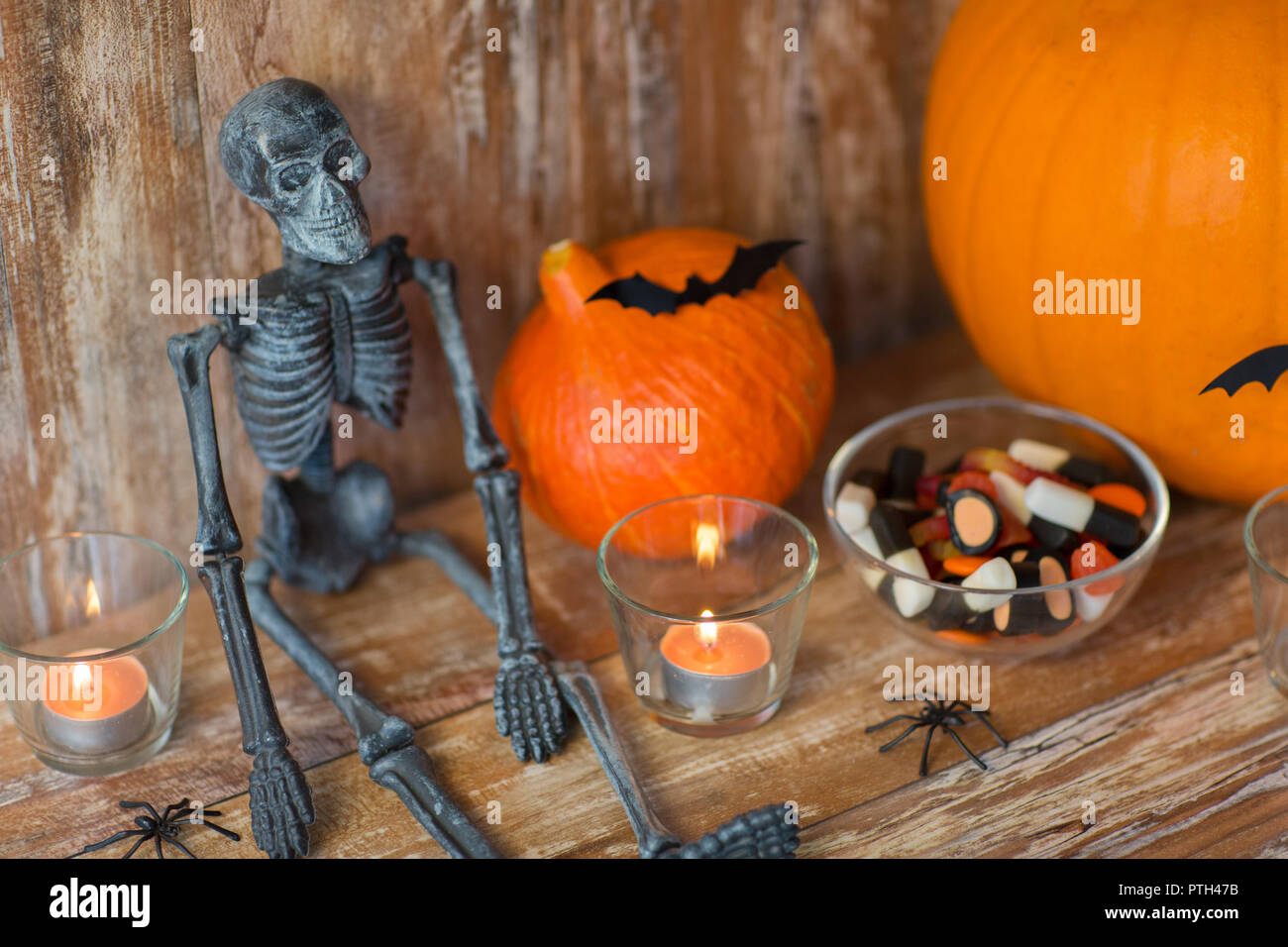halloween pumpkins, skeleton and candies Stock Photo - Alamy