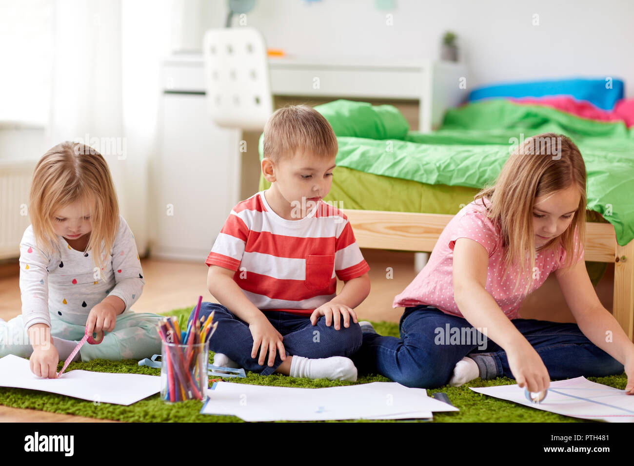happy kids drawing at home Stock Photo - Alamy