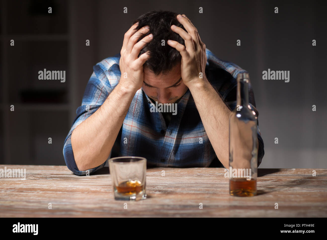alcoholic with bottle drinking whiskey at night Stock Photo - Alamy