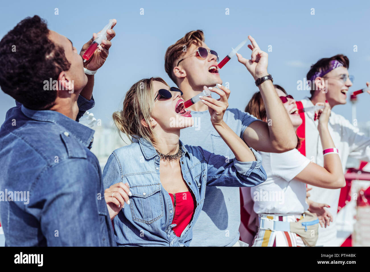 Playful young people raising their heads ups Stock Photo - Alamy