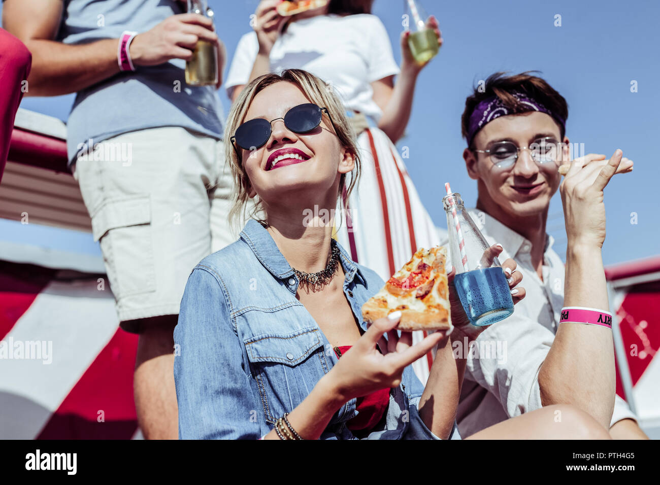 Charming girl enjoying her weekend with colleagues Stock Photo - Alamy
