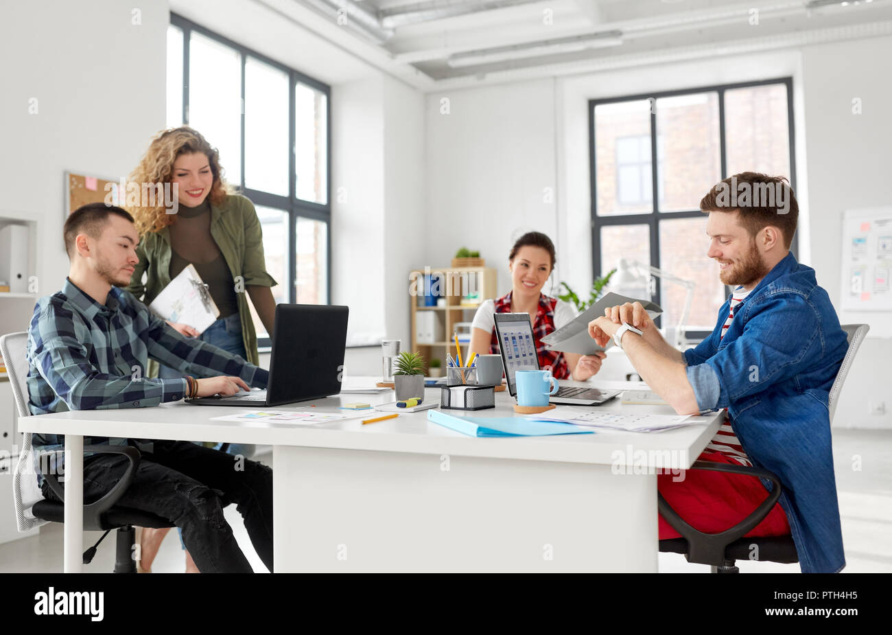 creative team working on user interface at office Stock Photo - Alamy
