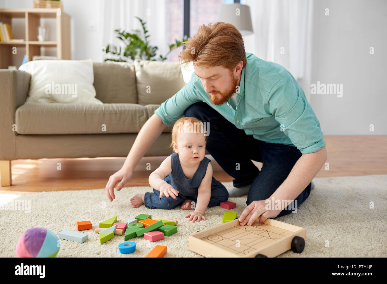 father and baby playing with toy blocks at home Stock Photo - Alamy