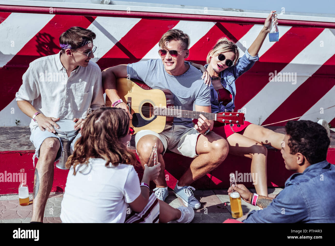 Pleased people having fun together on rooftop Stock Photo - Alamy