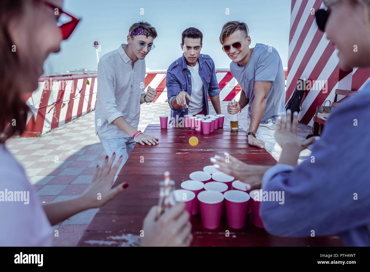 Serious male person looking at flying ball Stock Photo - Alamy