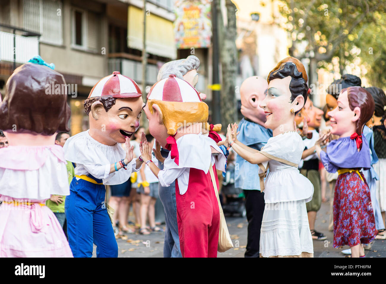 Dwarf dancing and playing together on the Rambla during the the Festa ...