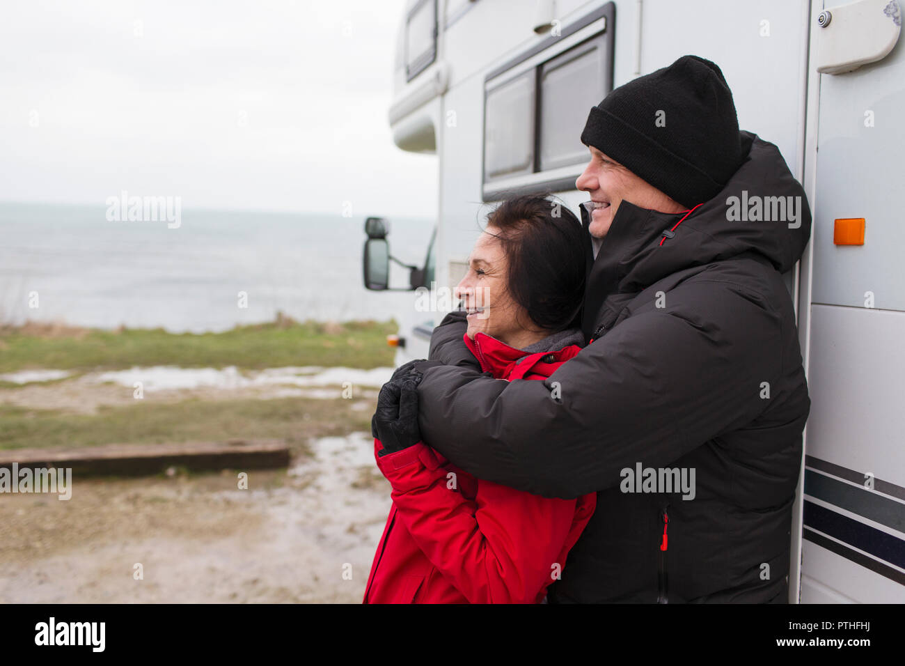 Couple hugging camper van hi-res stock photography and images - Alamy
