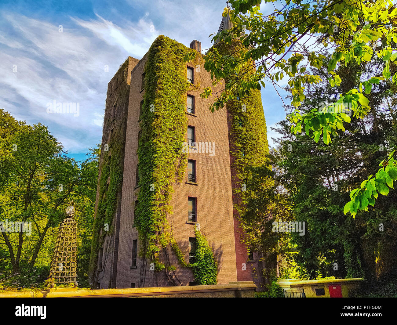 Flat high brick house block with tower Stock Photo - Alamy