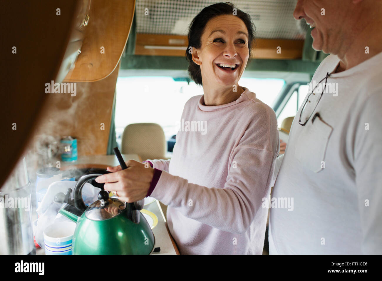 Couple making tea in motor home Stock Photo - Alamy