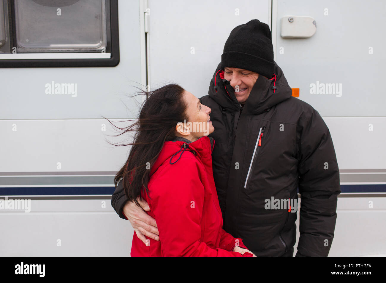Couple hugging camper van hi-res stock photography and images - Alamy
