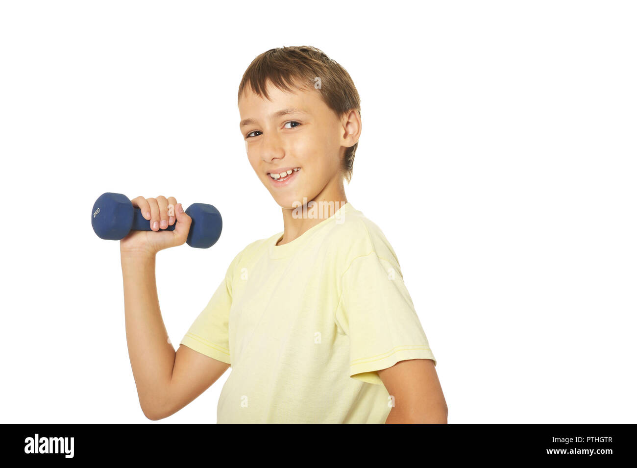 Portrait of a young boy doing exercises on white background Stock Photo ...