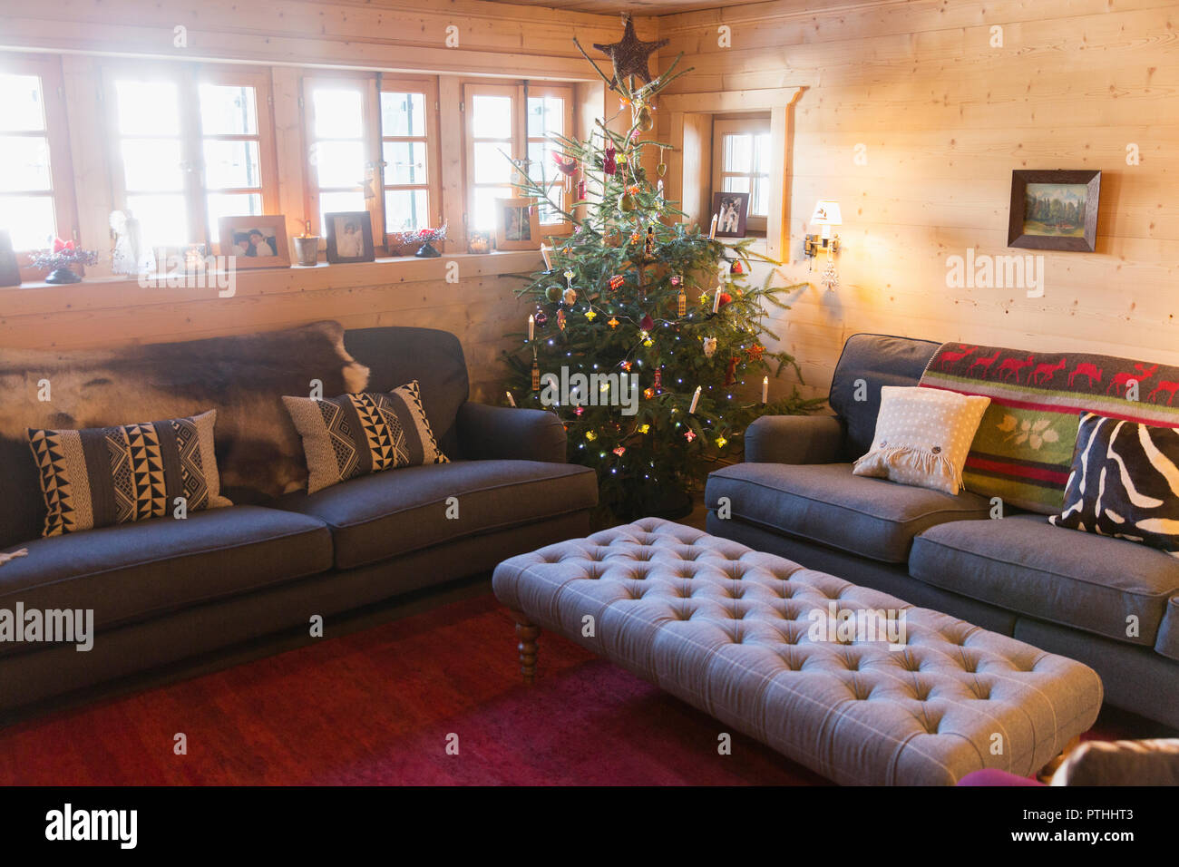 Christmas tree in living room Stock Photo - Alamy